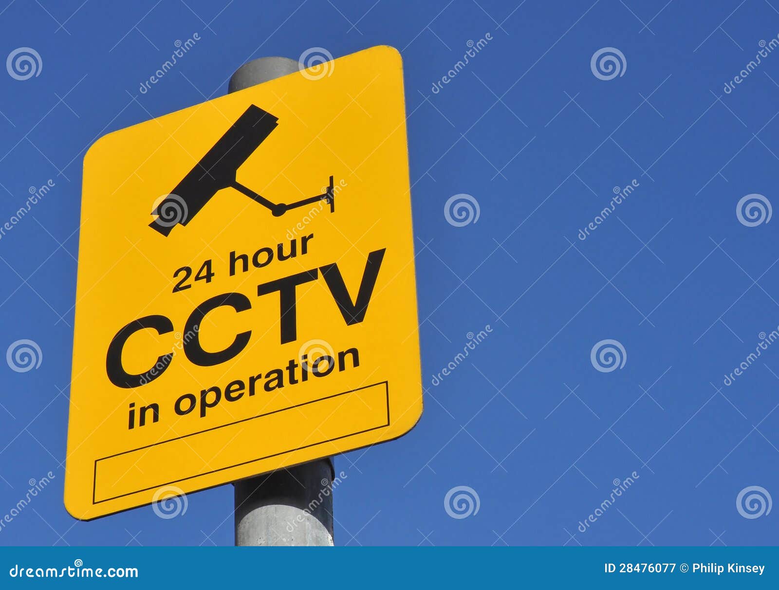 CCTV Warning Sign With Camera In The Background Behind Barbed Wire ...