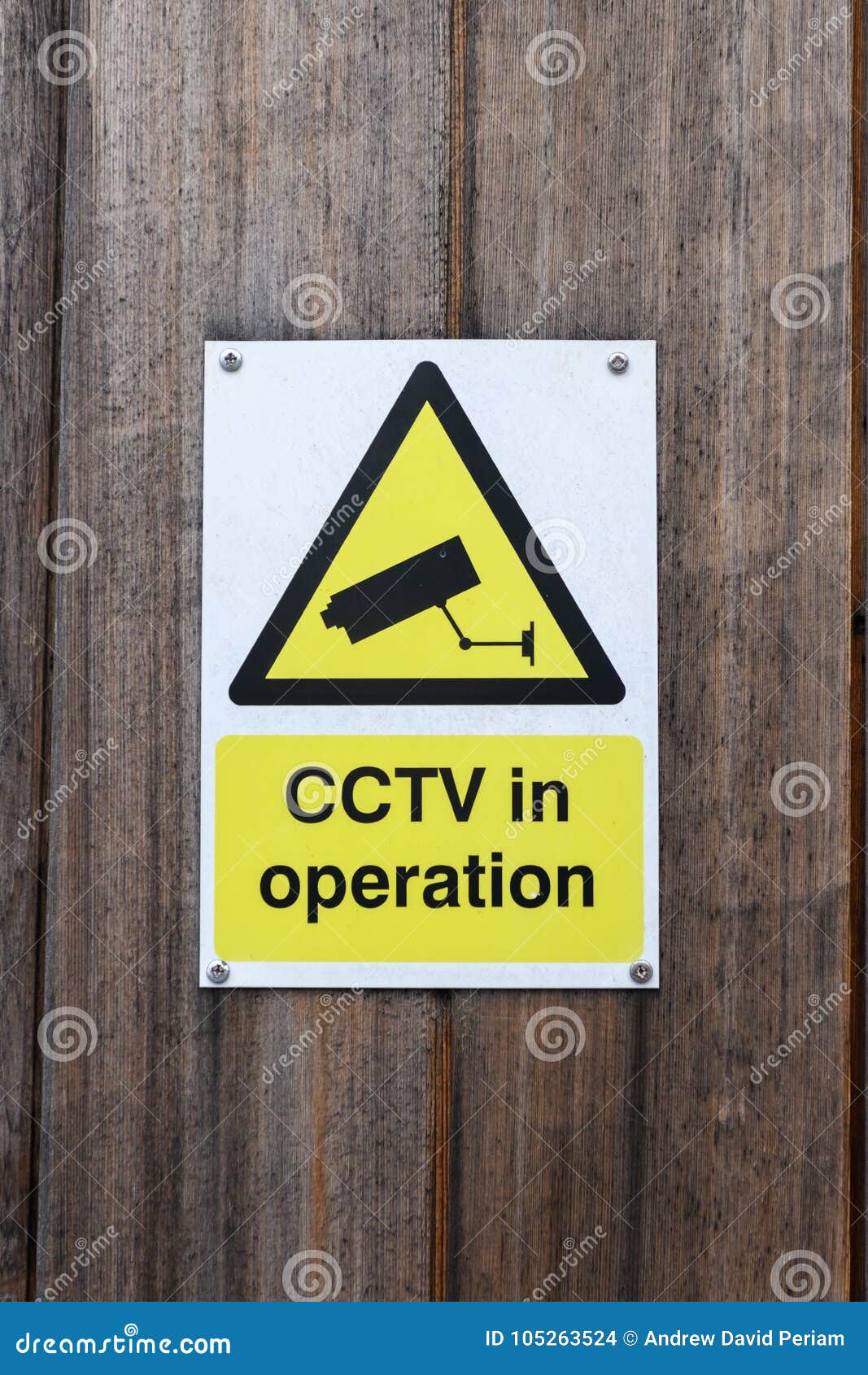 CCTV Warning Sign With Camera In The Background Behind Barbed Wire ...