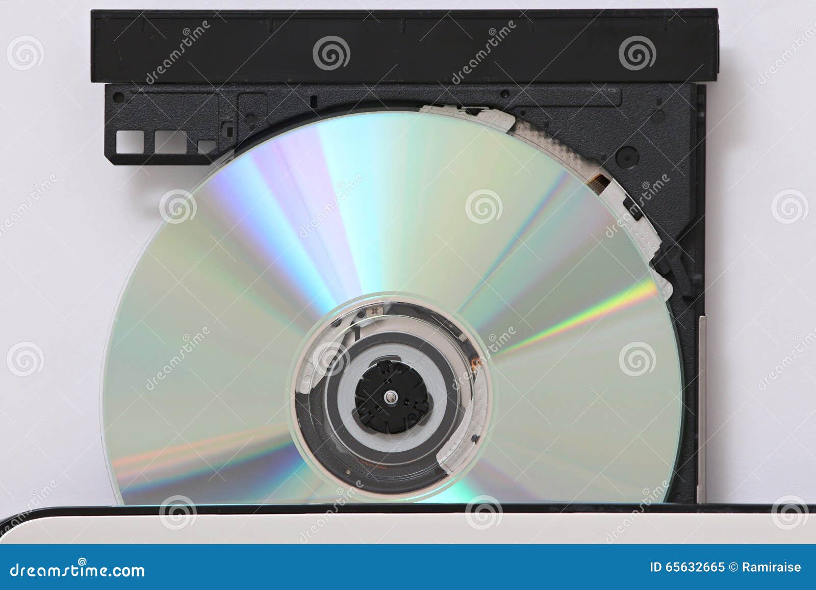 CD into a computer stock image. Image of program, blueray - 65632665