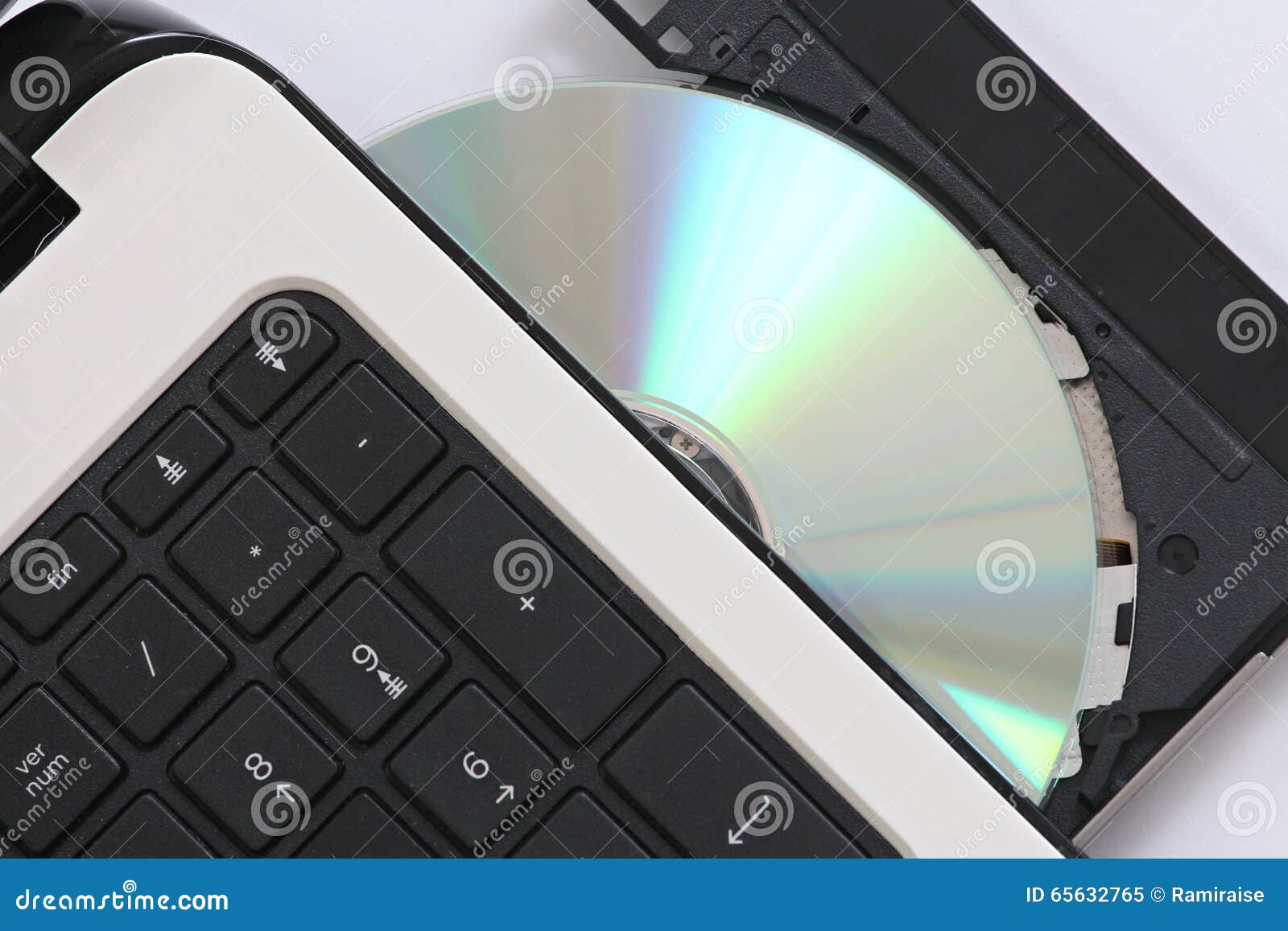 CD into a computer stock image. Image of disk, files - 65632765