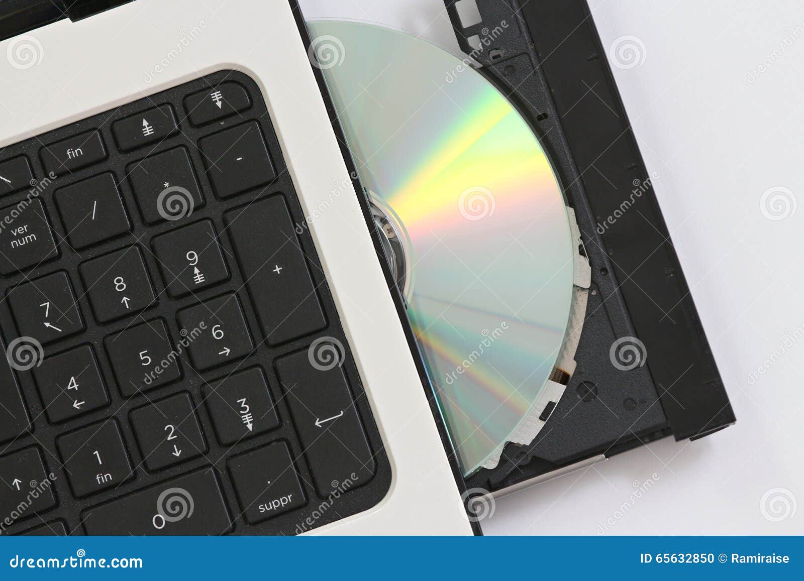 CD into a computer stock photo. Image of music, blueray - 65632850