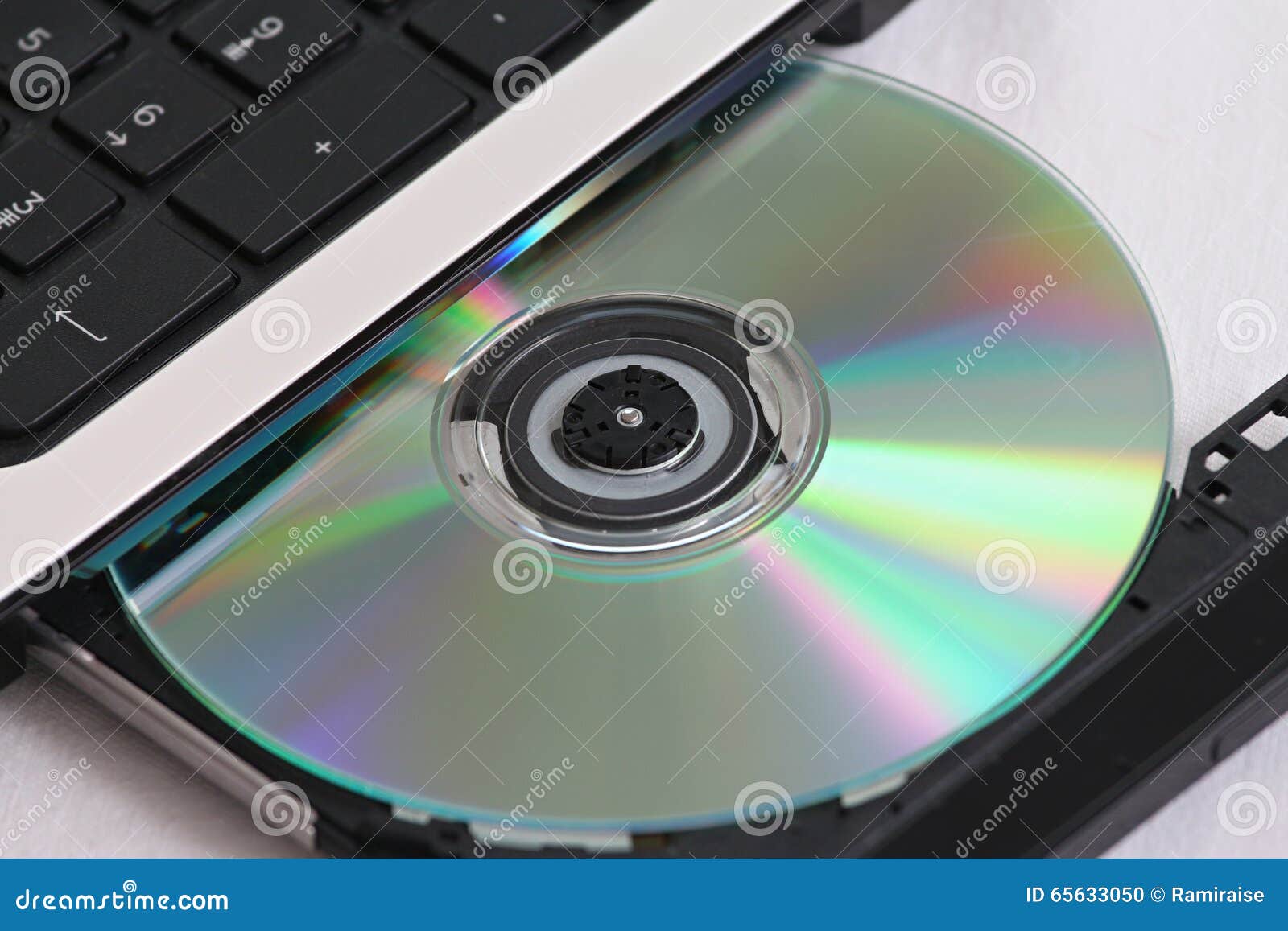 CD into a computer stock photo. Image of read, compact - 65633050