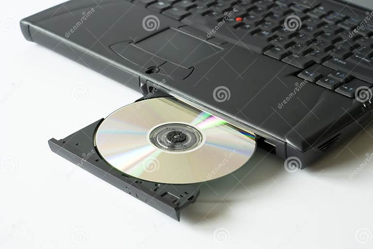 Cd in laptop disc drive stock image. Image of business - 4782733