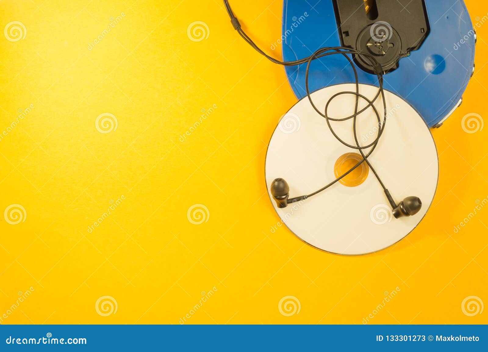 Cd Player and Compact Disc with Earphones on Yellow Background. Copy ...