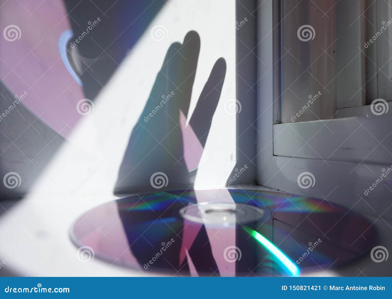 Cd Relfection with Hand and Lights Stock Image - Image of hand, shadows ...