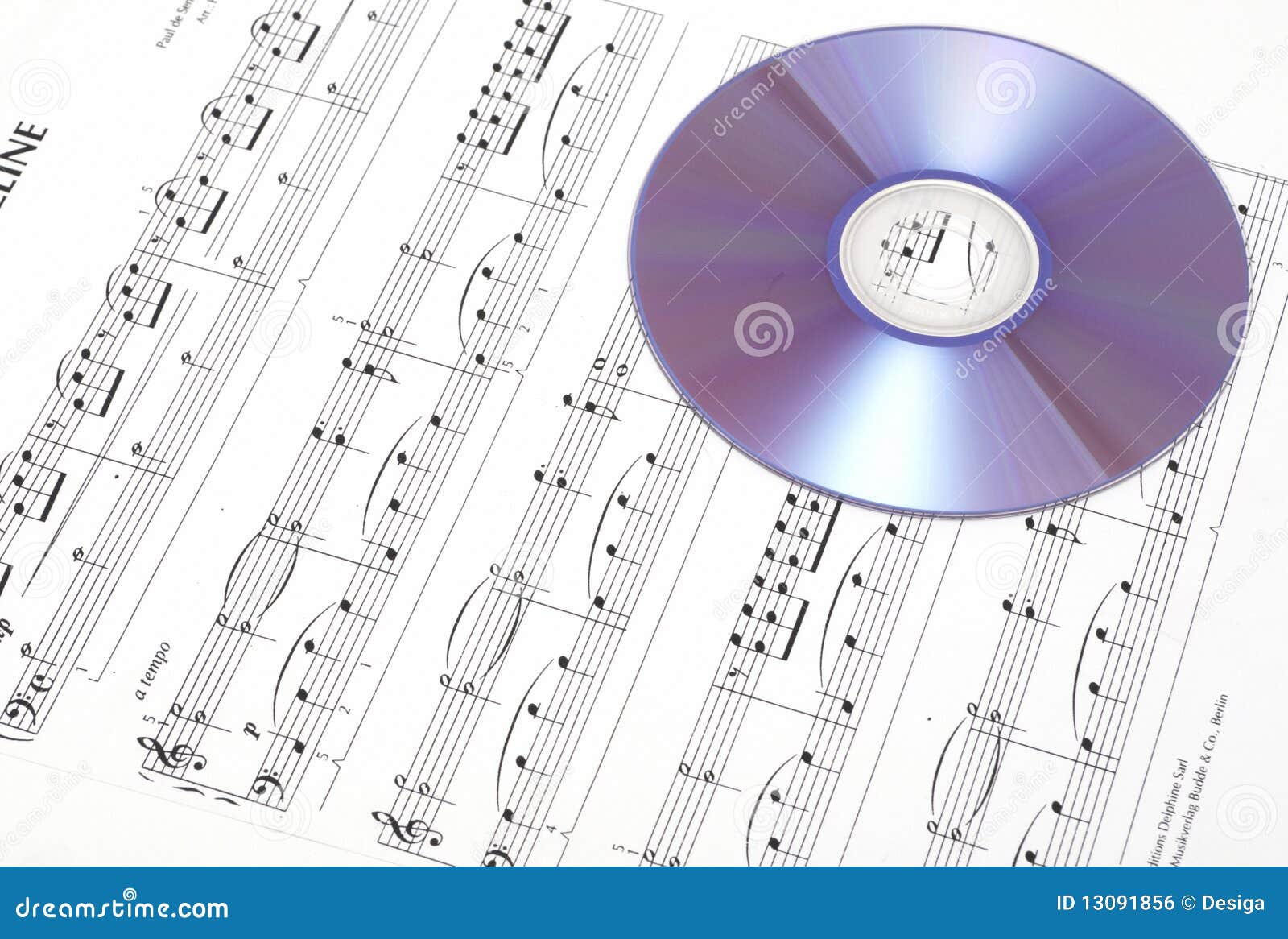 CD on sheet music. stock photo. Image of disk, abstract - 13091856