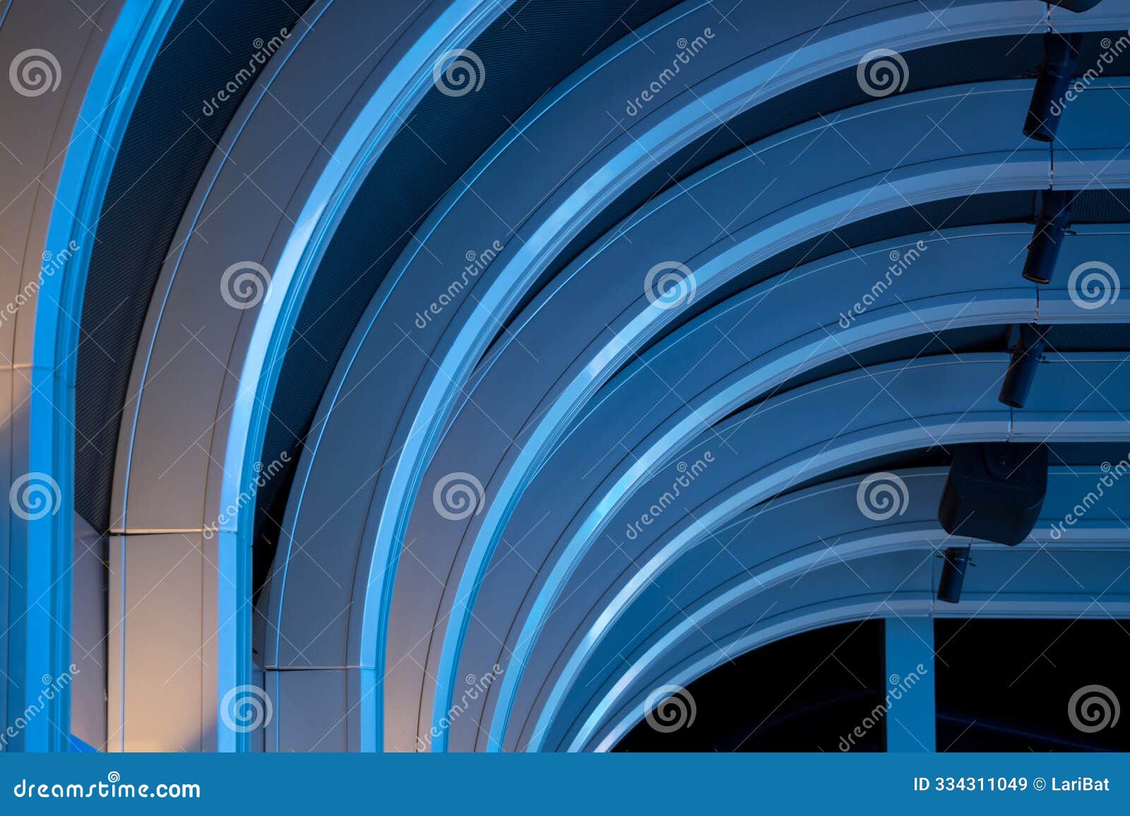 Ceiling with Curved Blue and White LED Strips and Suspended Directional ...