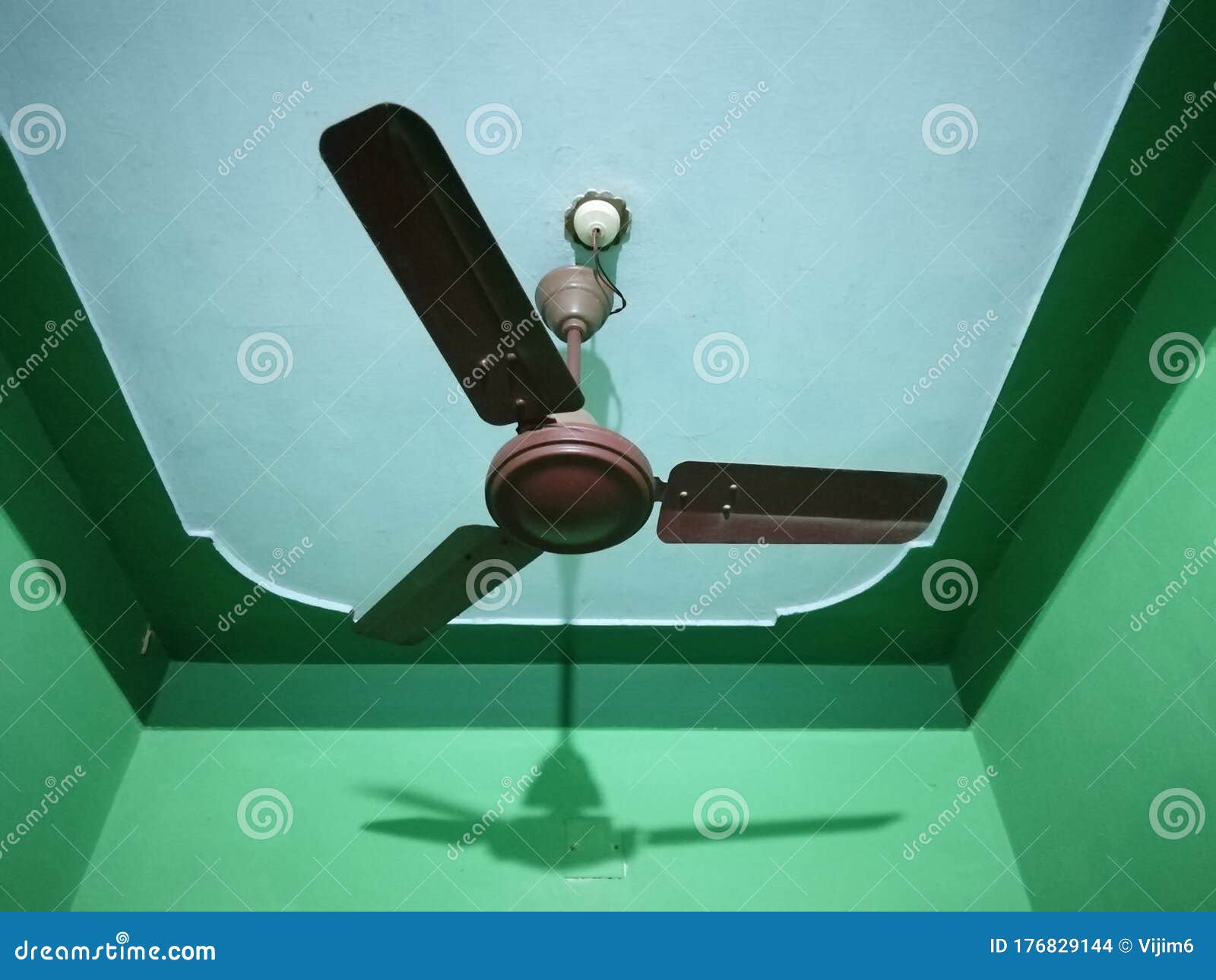 Ceiling fan shadow on wall stock photo. Image of ceiling - 176829144