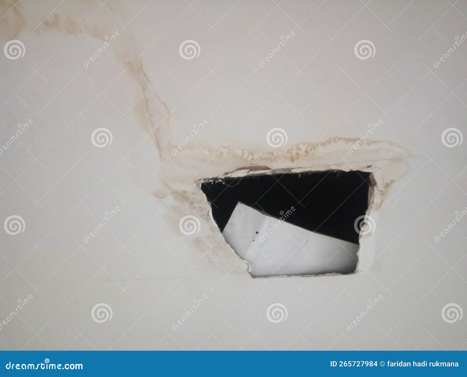 The Ceiling of the Gypsum Ceiling Which is Damaged with Holes Stock ...