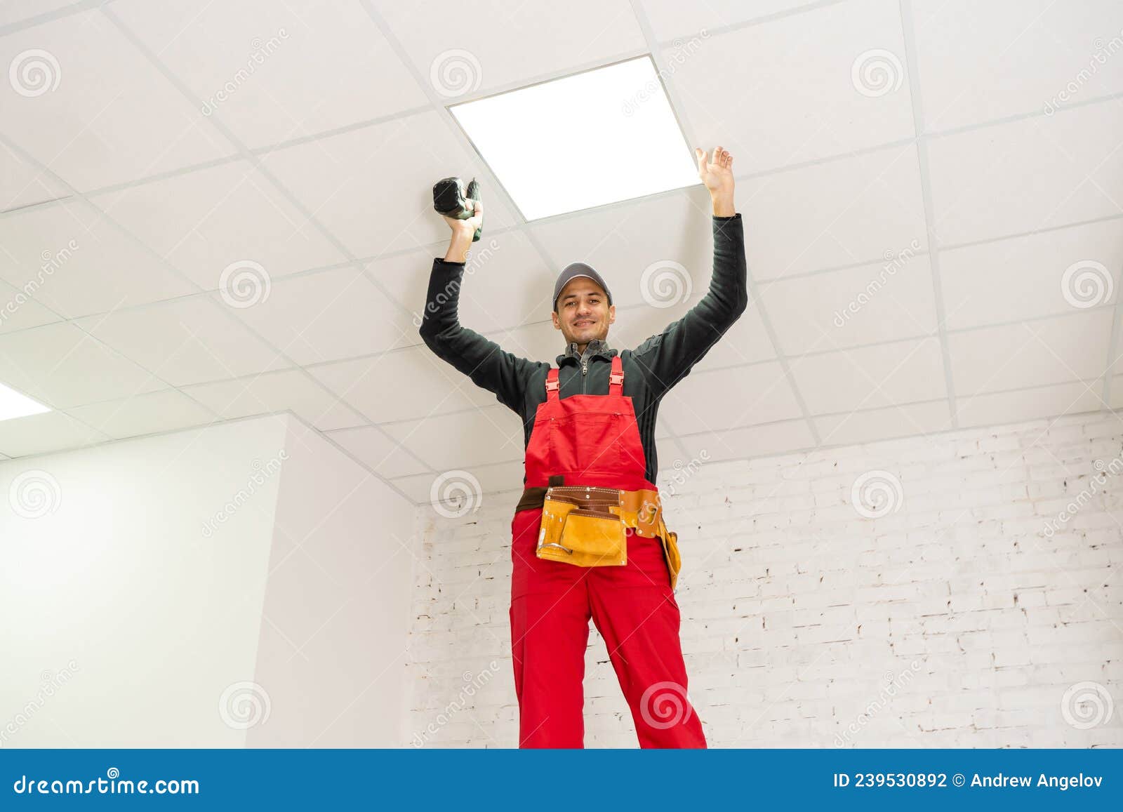 Ceiling Installation with Expert Technicians in the Room that is in the ...