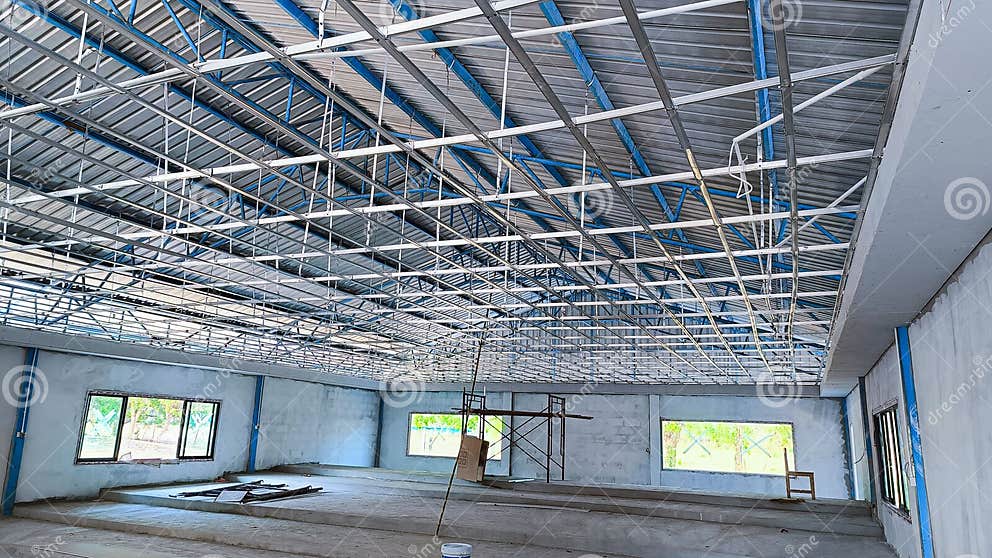 Ceiling Installation with Expert Technicians in the Room that is in the Construction Process ...