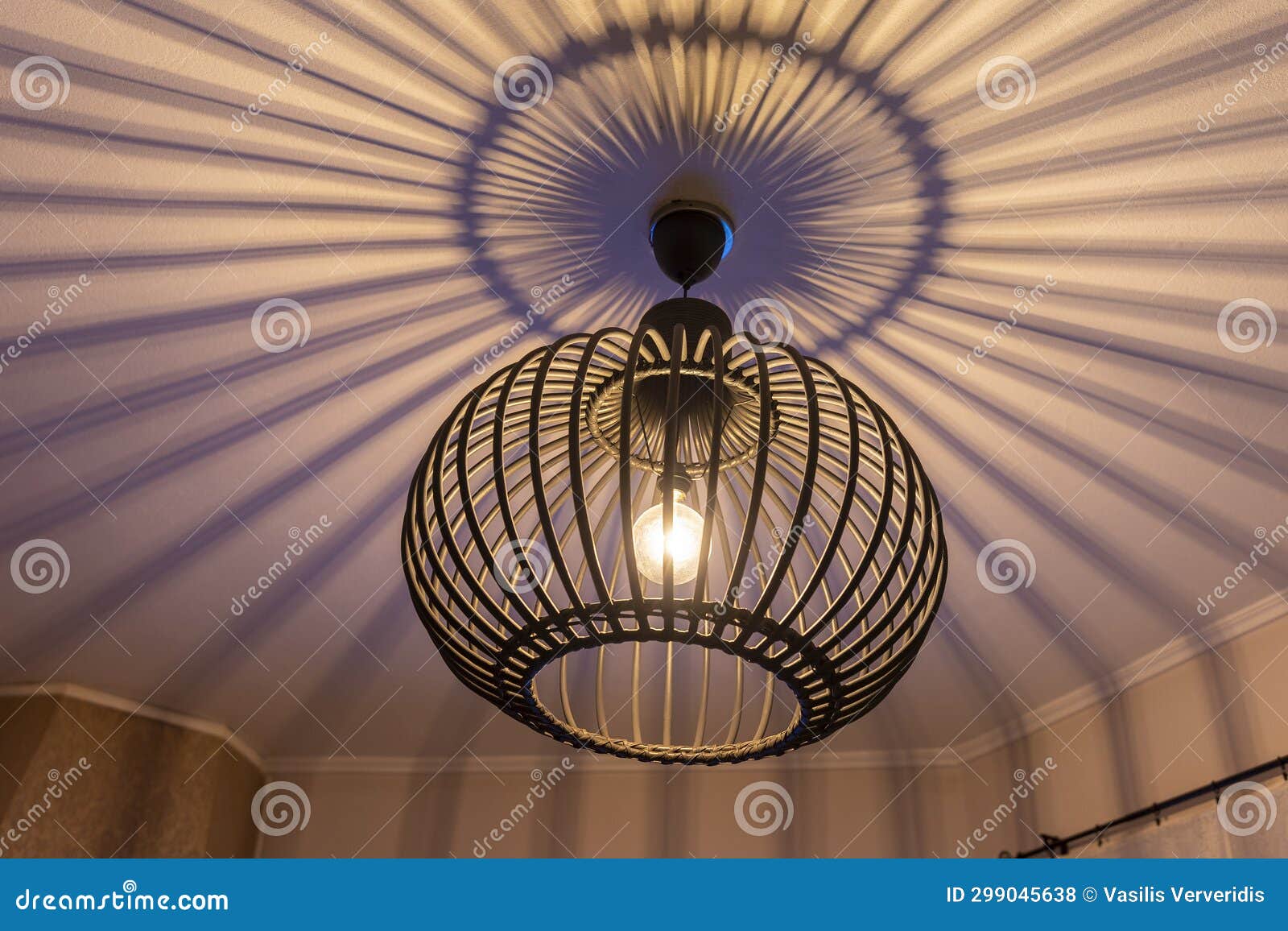 Ceiling Light with Light Rays Creating an Effect on the Wall Stock ...