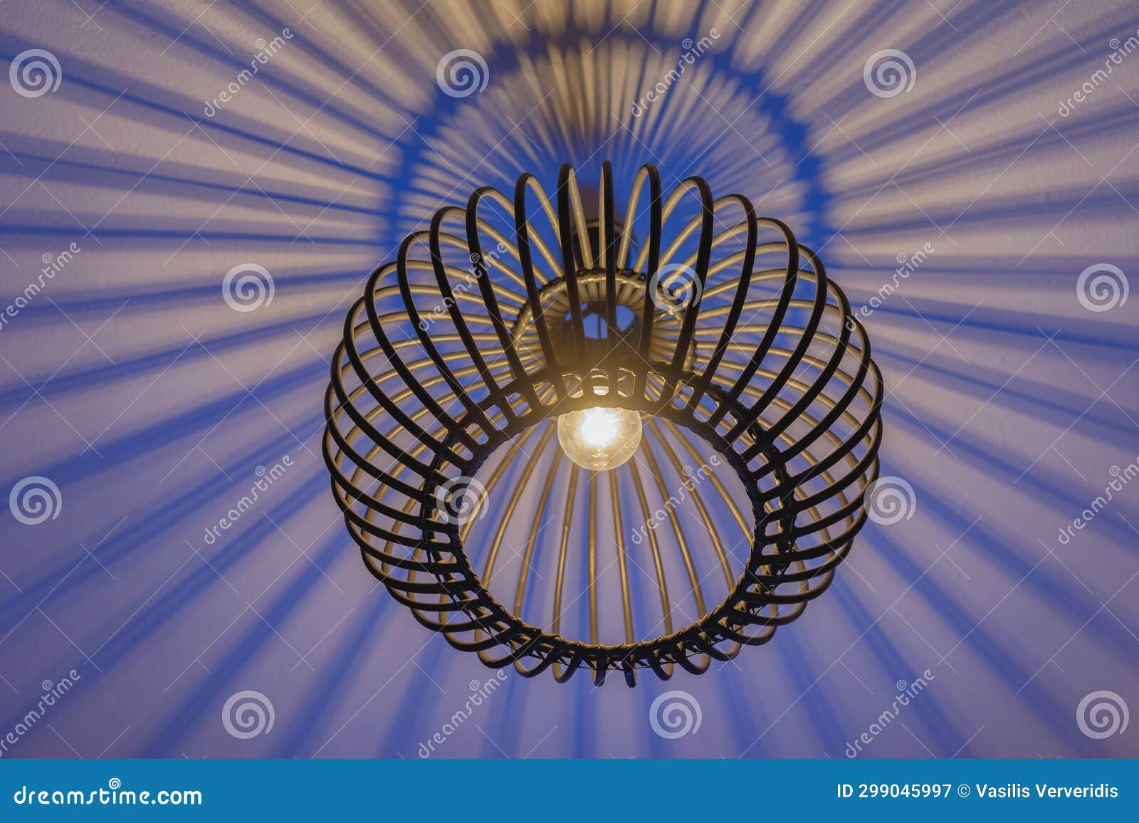 Ceiling Light with Light Rays Creating an Effect on the Wall Stock ...