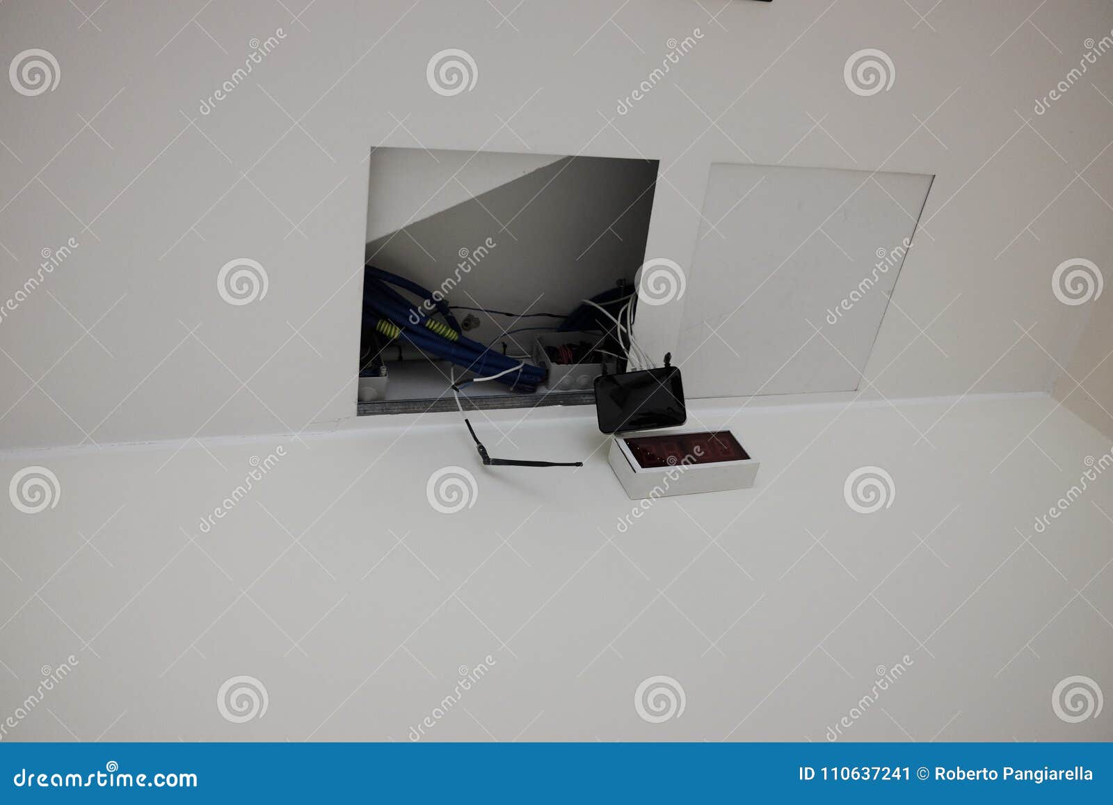 Ceiling modem installation stock image. Image of wire - 110637241