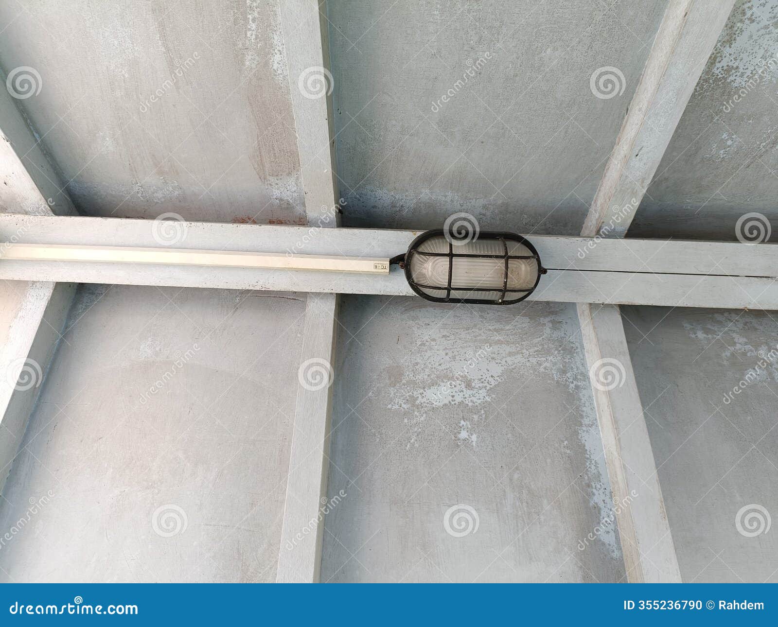 Ceiling Structure with Exposed Beams and Industrial Cage Light Stock ...