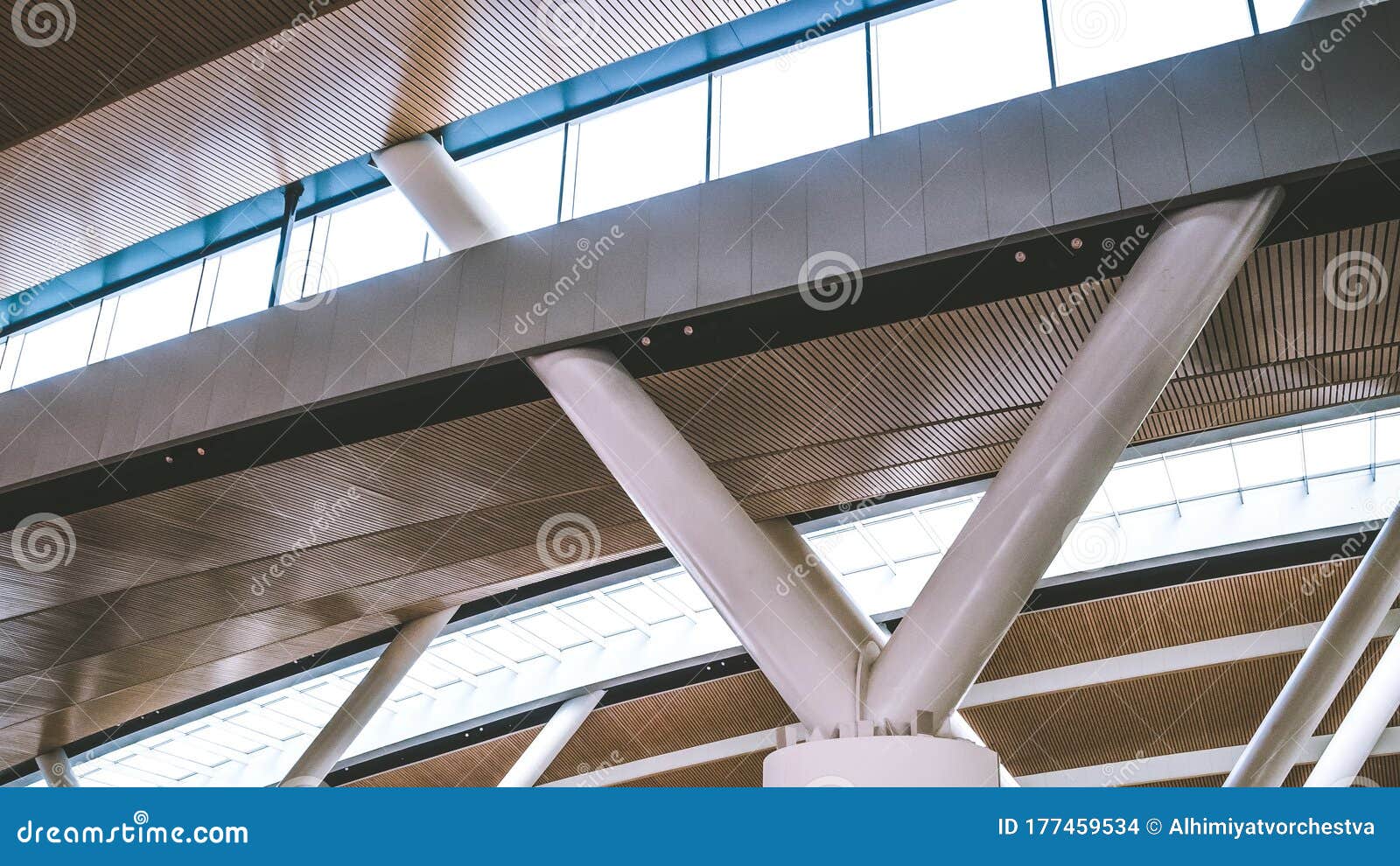 Ceiling with Wood Paneling and Windows, Large Metal Columns in a Modern ...