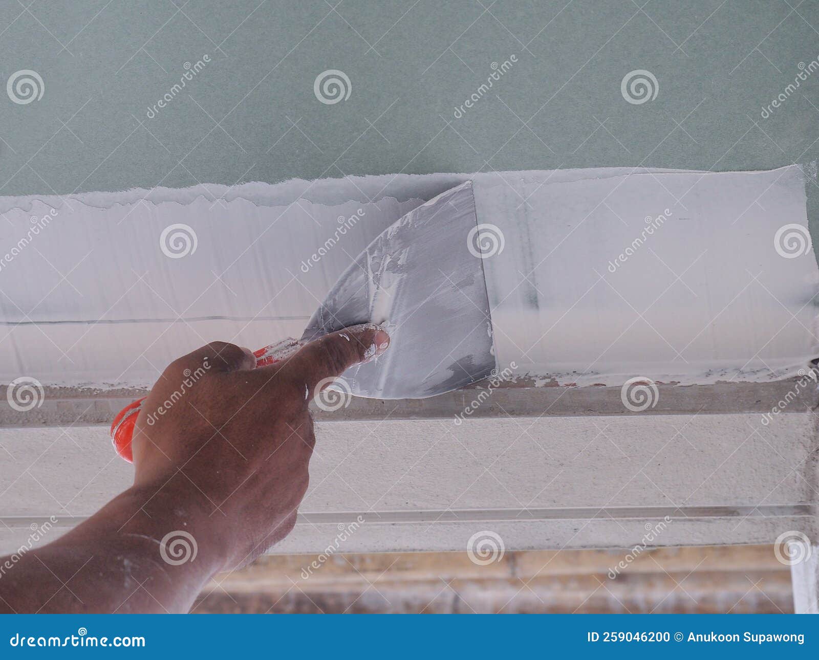 The Ceiling Worker is Plastering the Ceiling Joints with High Quality ...