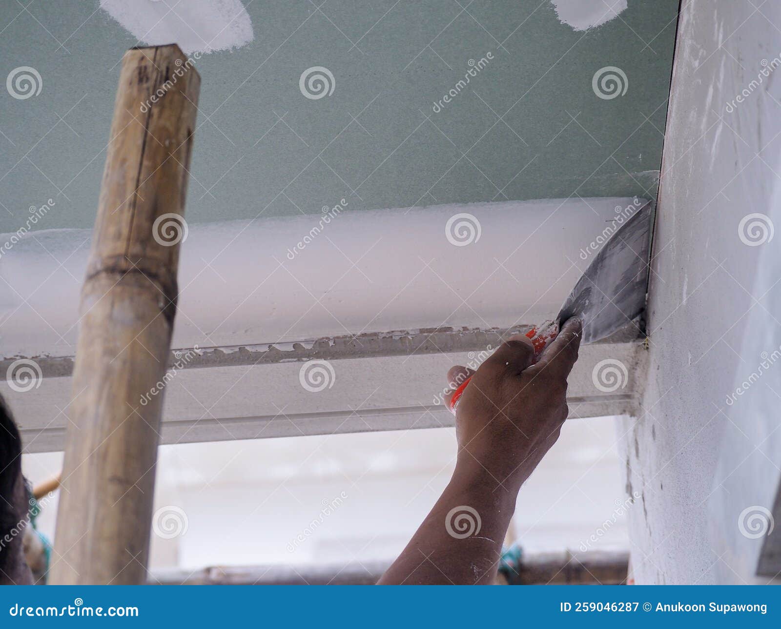 The Ceiling Worker is Plastering the Ceiling Joints with High Quality ...