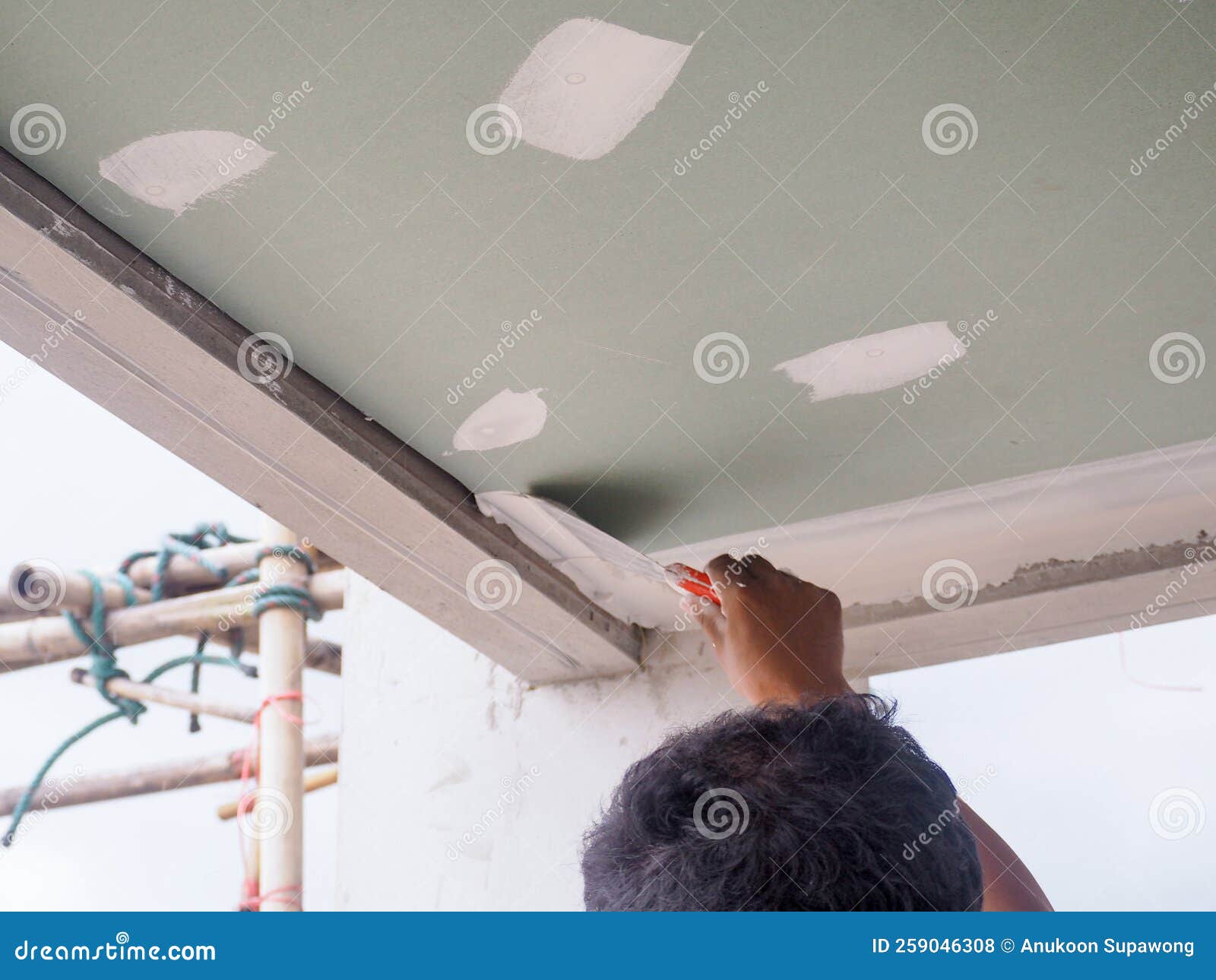The Ceiling Worker is Plastering the Ceiling Joints with High Quality ...