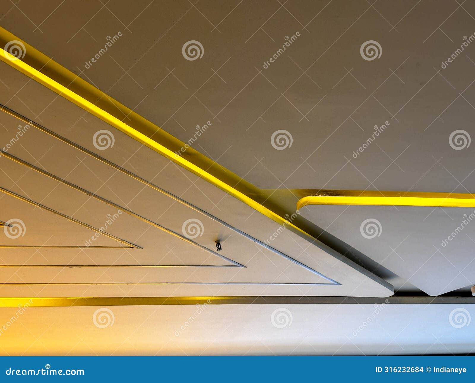 A Ceiling with a Yellow Light Shining on it Stock Photo - Image of roof ...