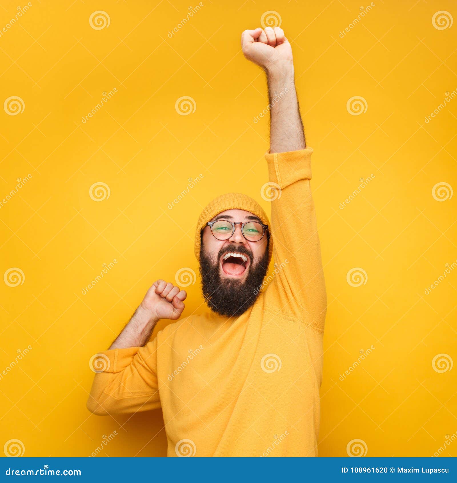 Celebrating Bearded Man with Hand Up Stock Photo - Image of celebrate ...