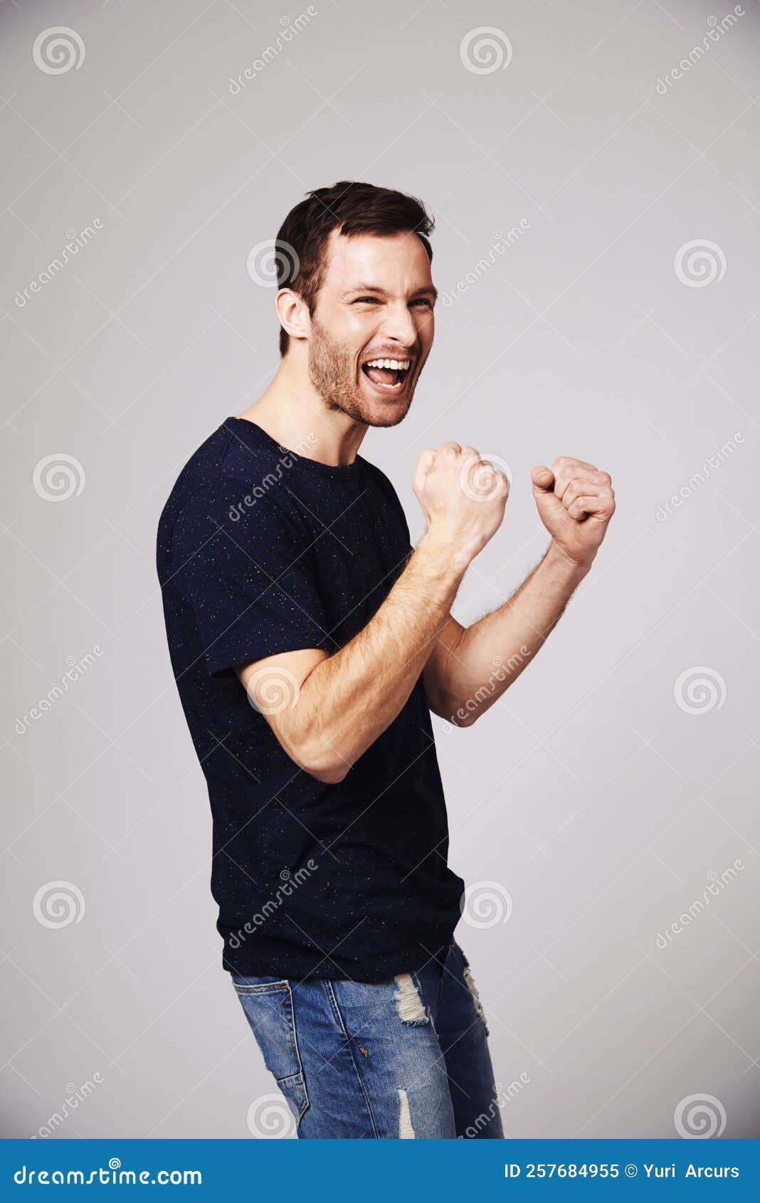 Celebrating His Achievements. a Handsome Young Man Celebrating in ...