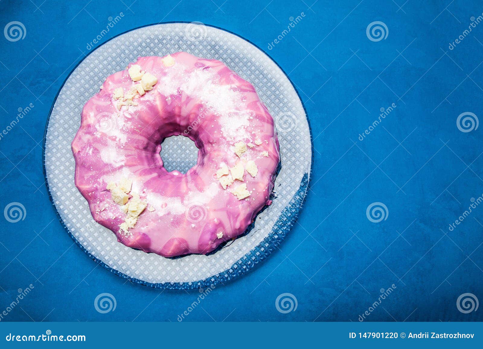 Celebratory Round Cake with Pink Icing on a Blue Background Stock Photo ...