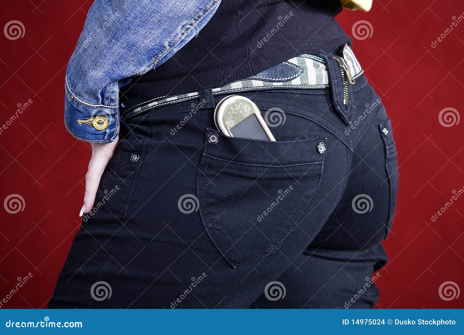 Cell phone in back pocket stock photo. Image of cell - 14975024