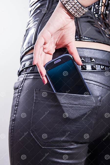 Cell phone in back pocket stock image. Image of communication - 34439333
