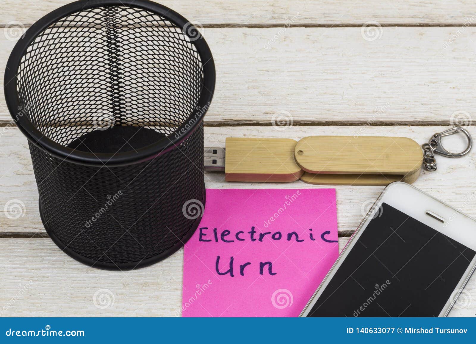 Cell Phone and Flash Drive Near Trash Can with the Words: Electronic ...