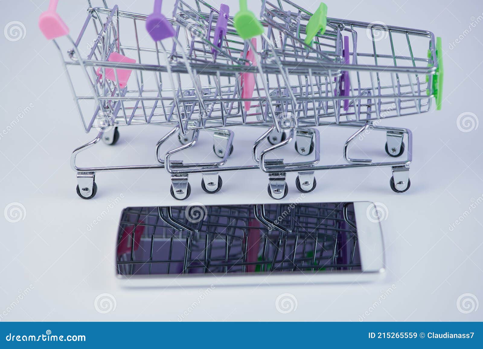 Cell Phone in Front of Miniature Shopping Carts Stock Image - Image of ...
