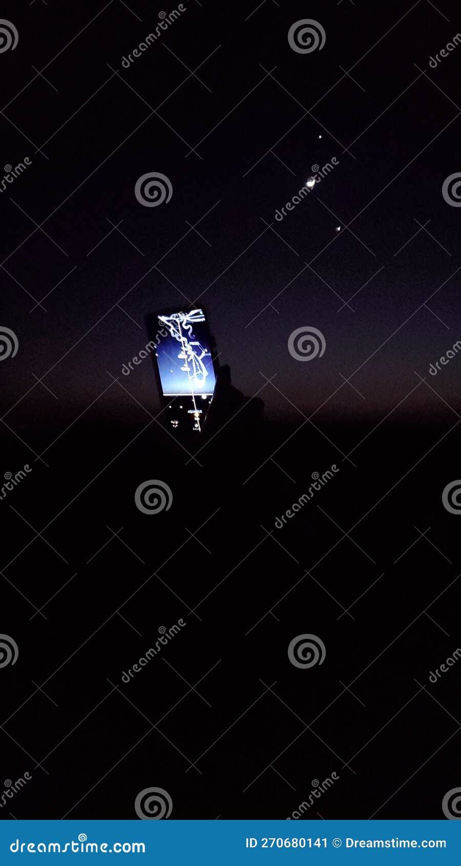 Cell Phone Held Up To Nighttime Celestial Alignment of Venus, Moon ...