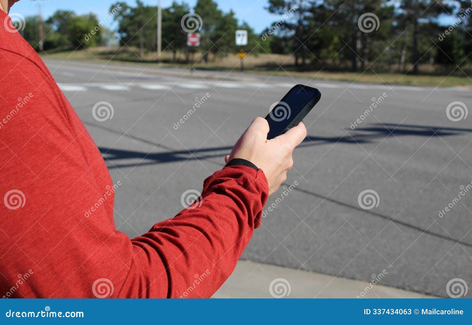 Cell Phone in a Man S Hand Arm Extended Waiting at Intersection Outside ...