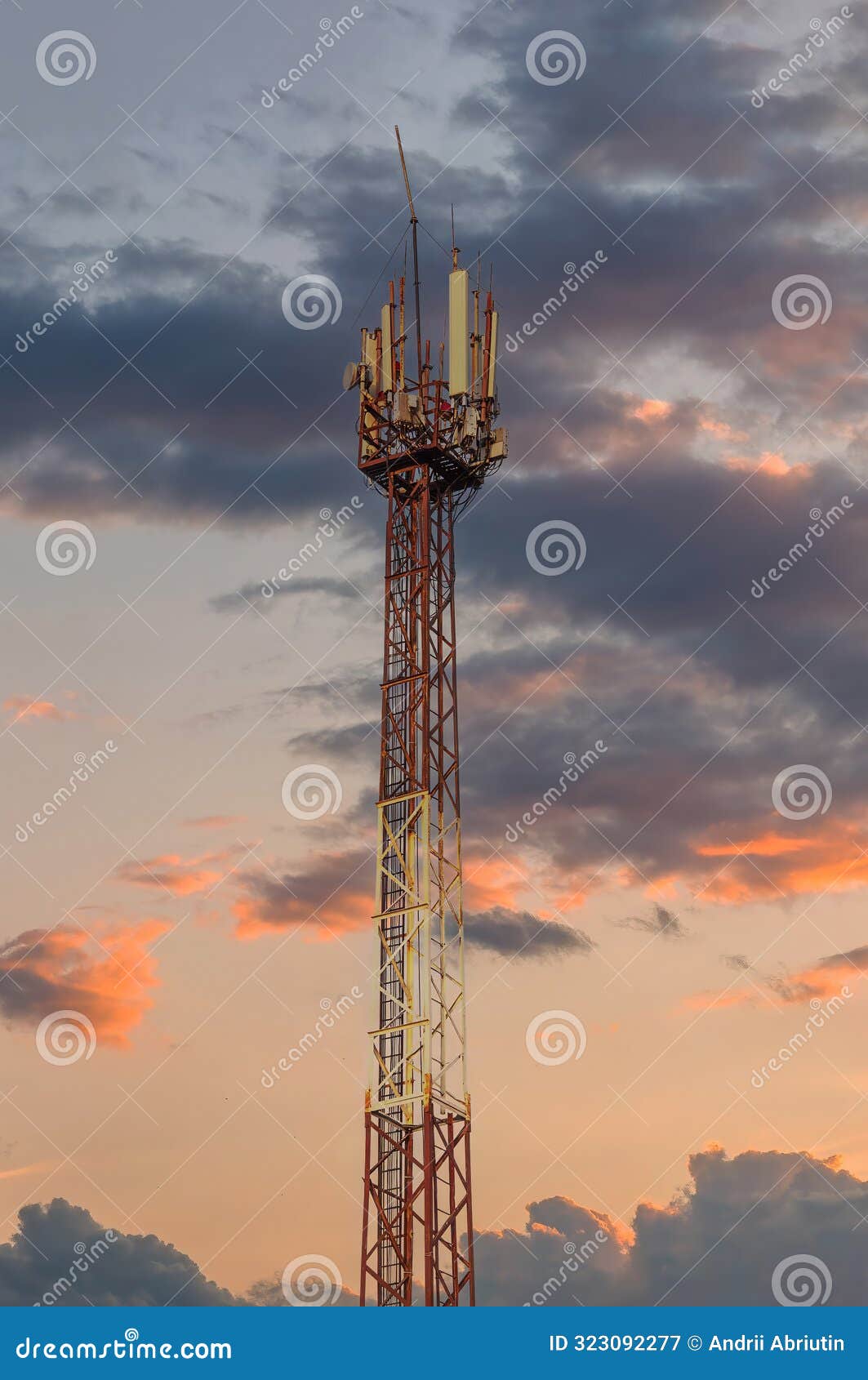 Cell Tower Against a Dramatic Sunset Sky with Clouds, Highlighting ...