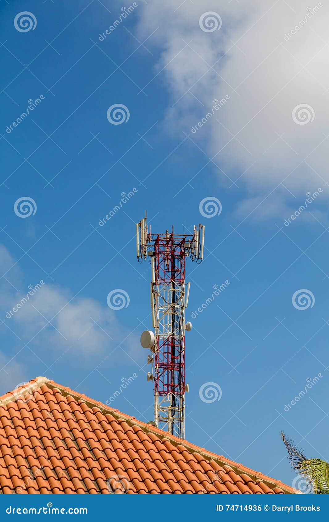 Cell Tower Over Tile Roof stock photo. Image of network - 74714936