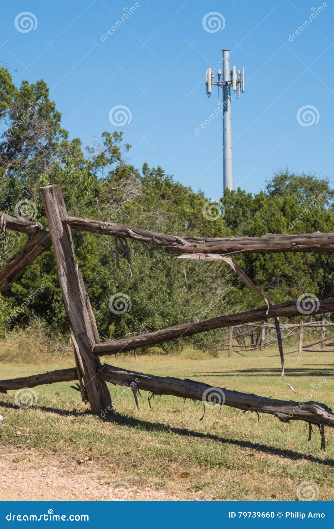 Cell Tower and a Ragged Fence Stock Photo - Image of blue, commerce ...