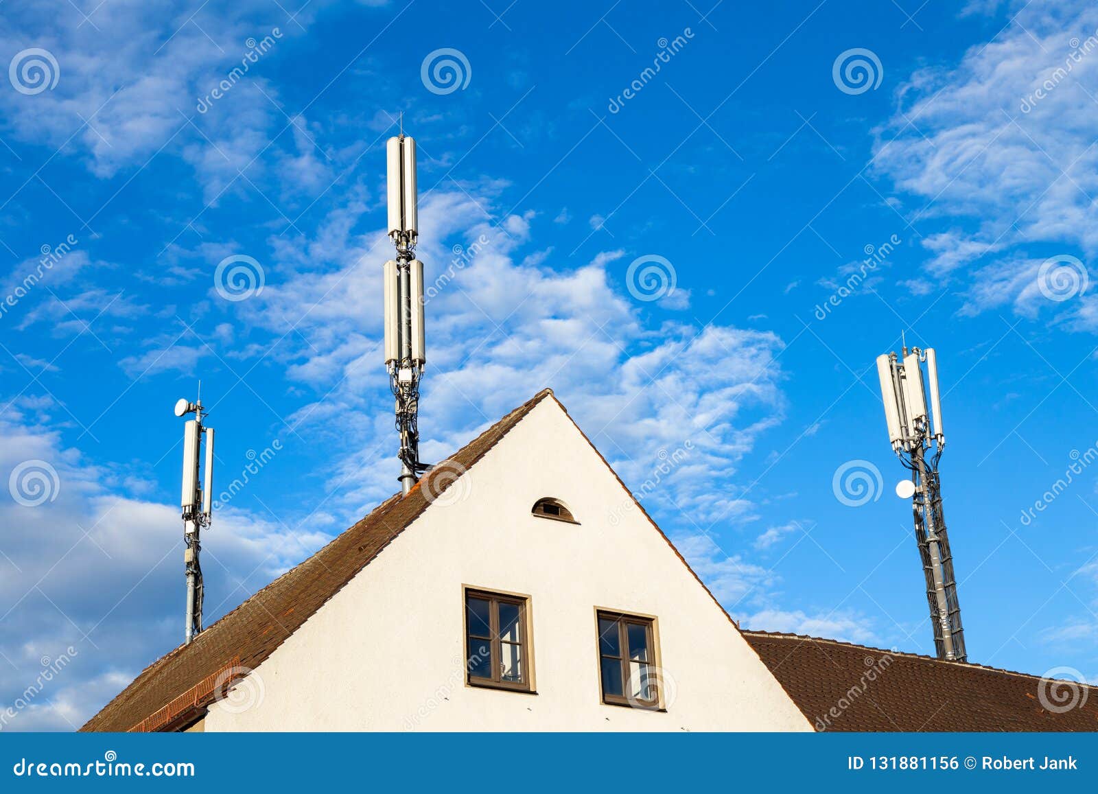 Cell tower on a rooftop stock photo. Image of house - 131881156