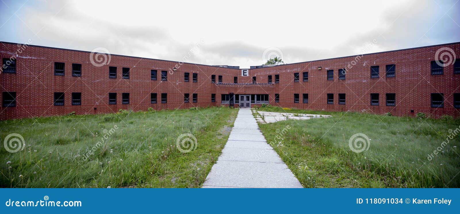 Exterior Of Prison Cell Block With Overgrown Yard Stock Image ...