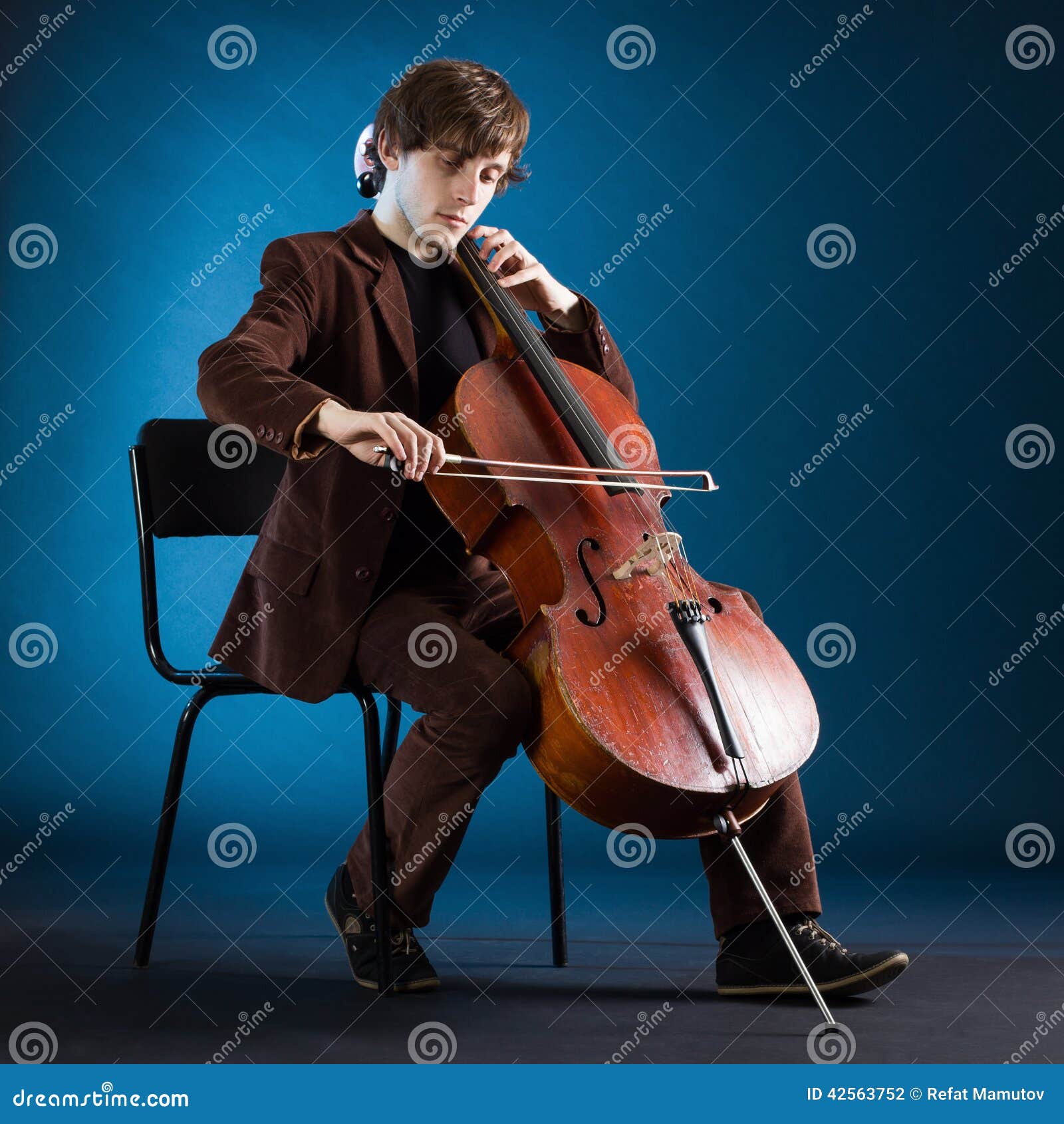 Cellist playing on cello stock photo. Image of musical - 42563752
