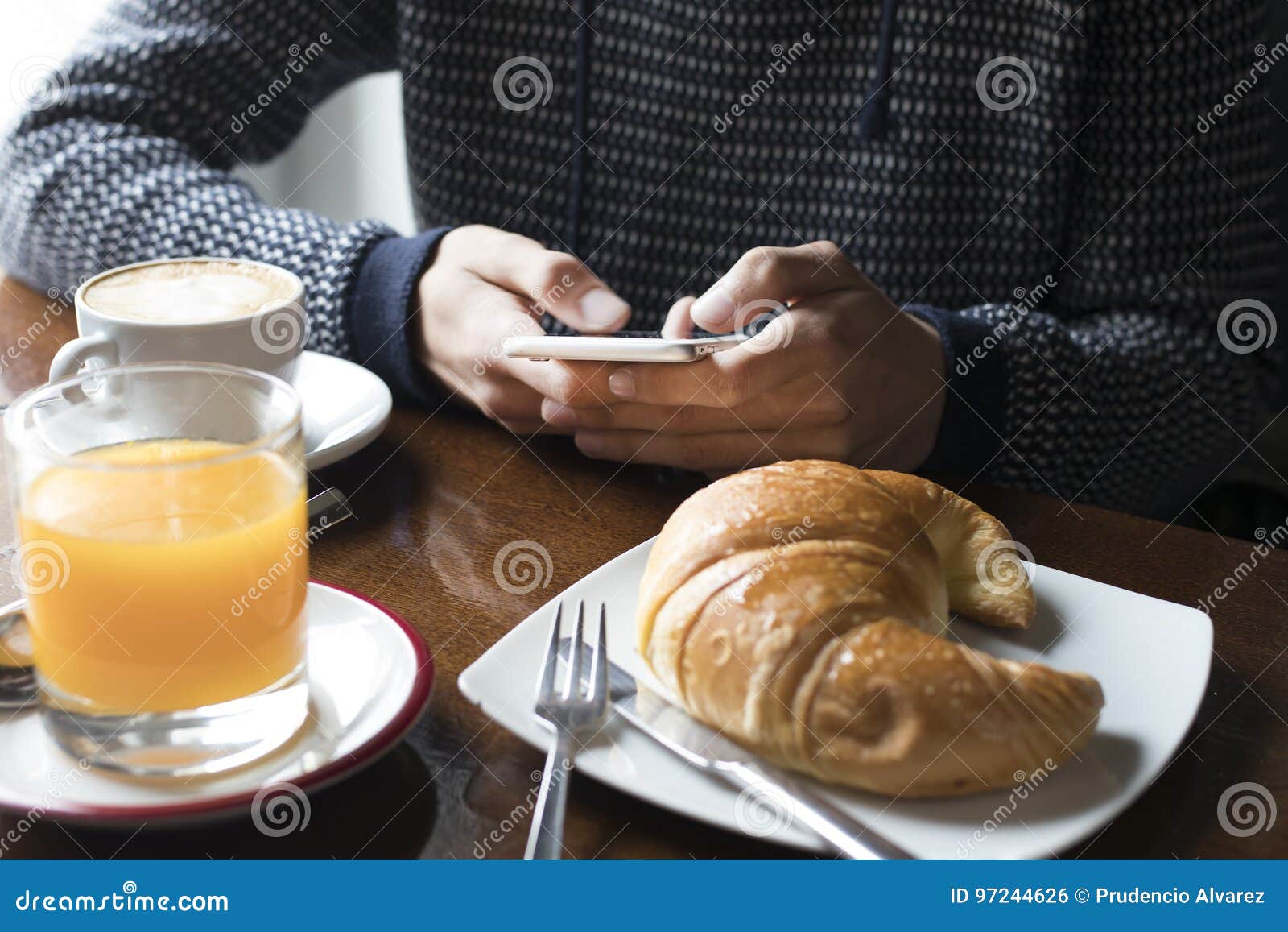 Cellphone in the cafeteria stock photo. Image of cellphone - 97244626