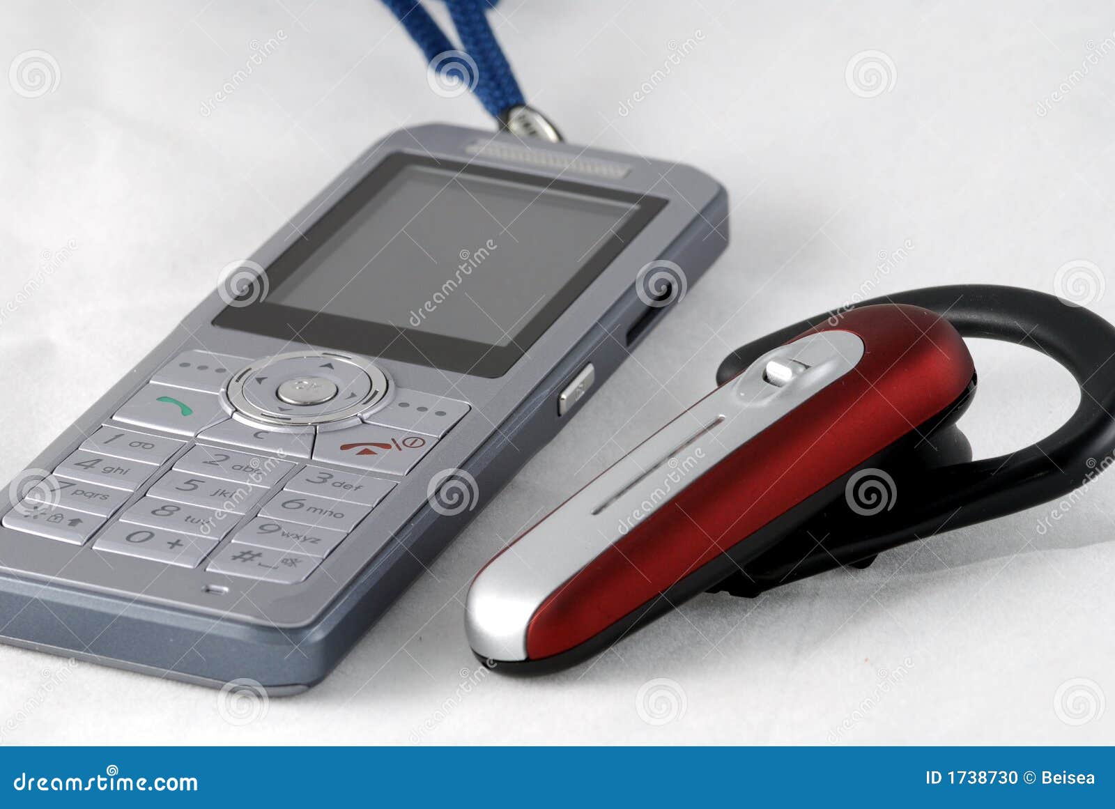 Cellphone and earpiece stock photo. Image of headphone - 1738730