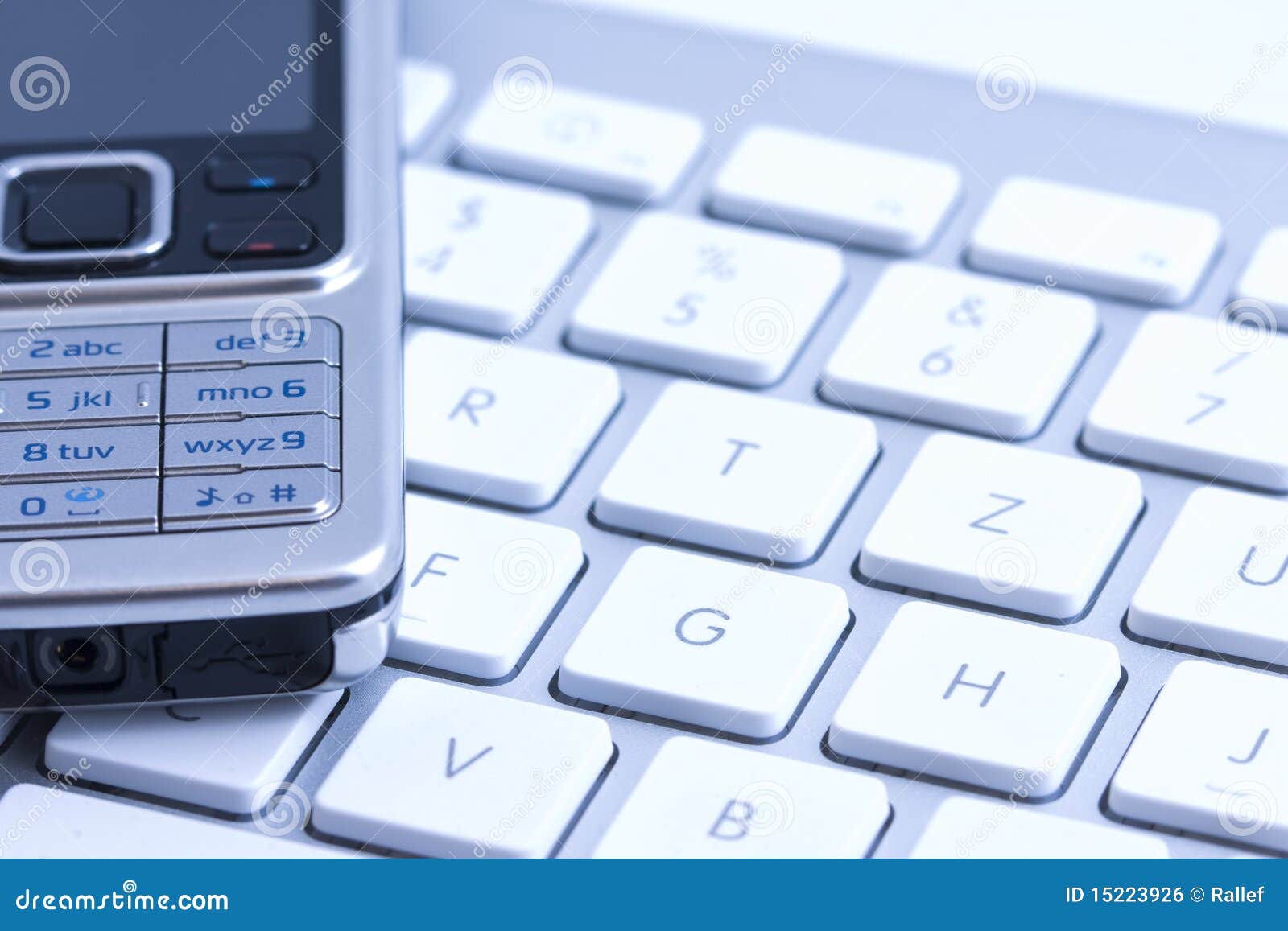 Cellphone on keyboard stock photo. Image of apple, accessories - 15223926