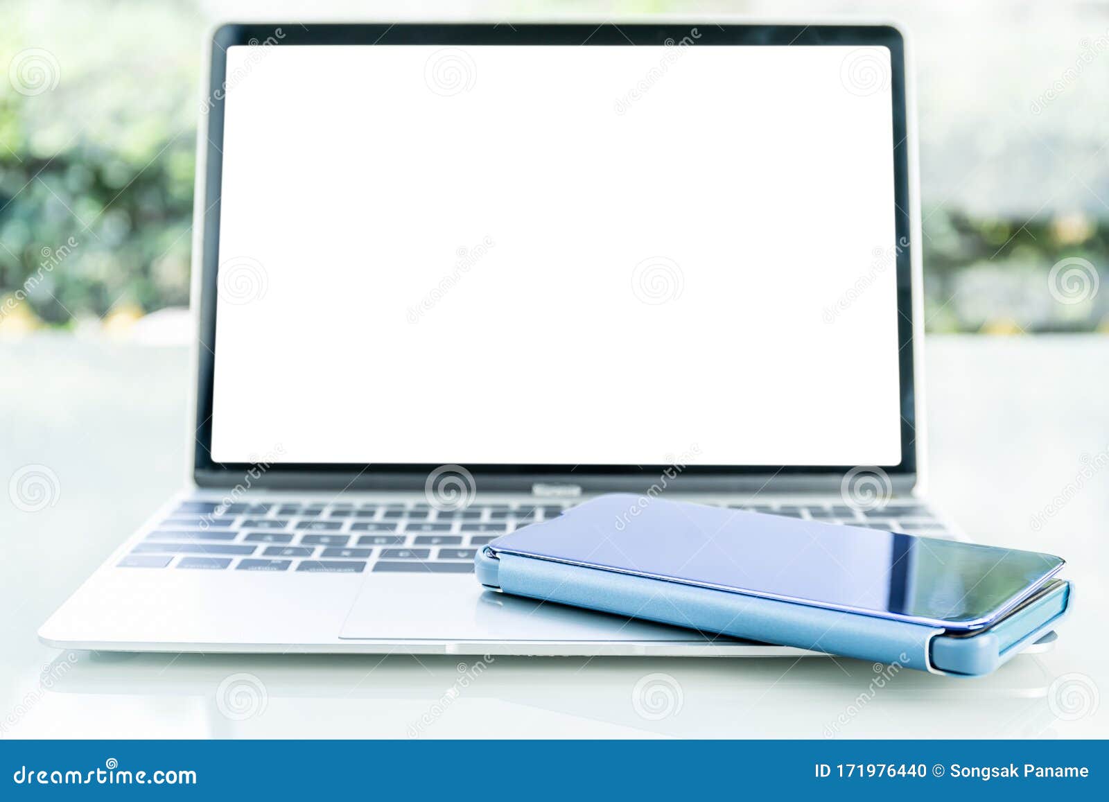 Cellphone on Laptop Computer on Table Stock Photo - Image of background ...