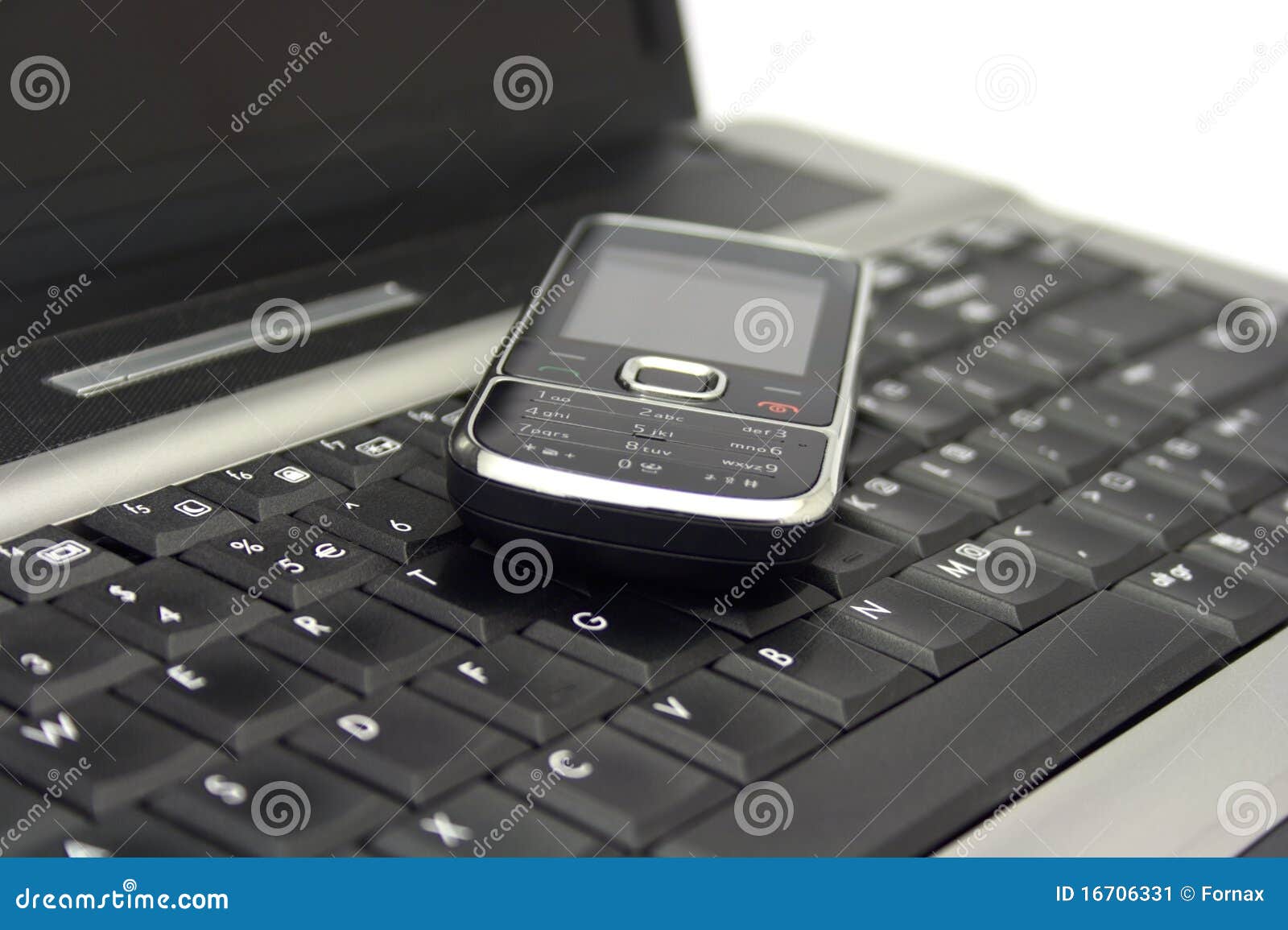 Cellphone on a Notebook Keypad Stock Image - Image of notebook ...