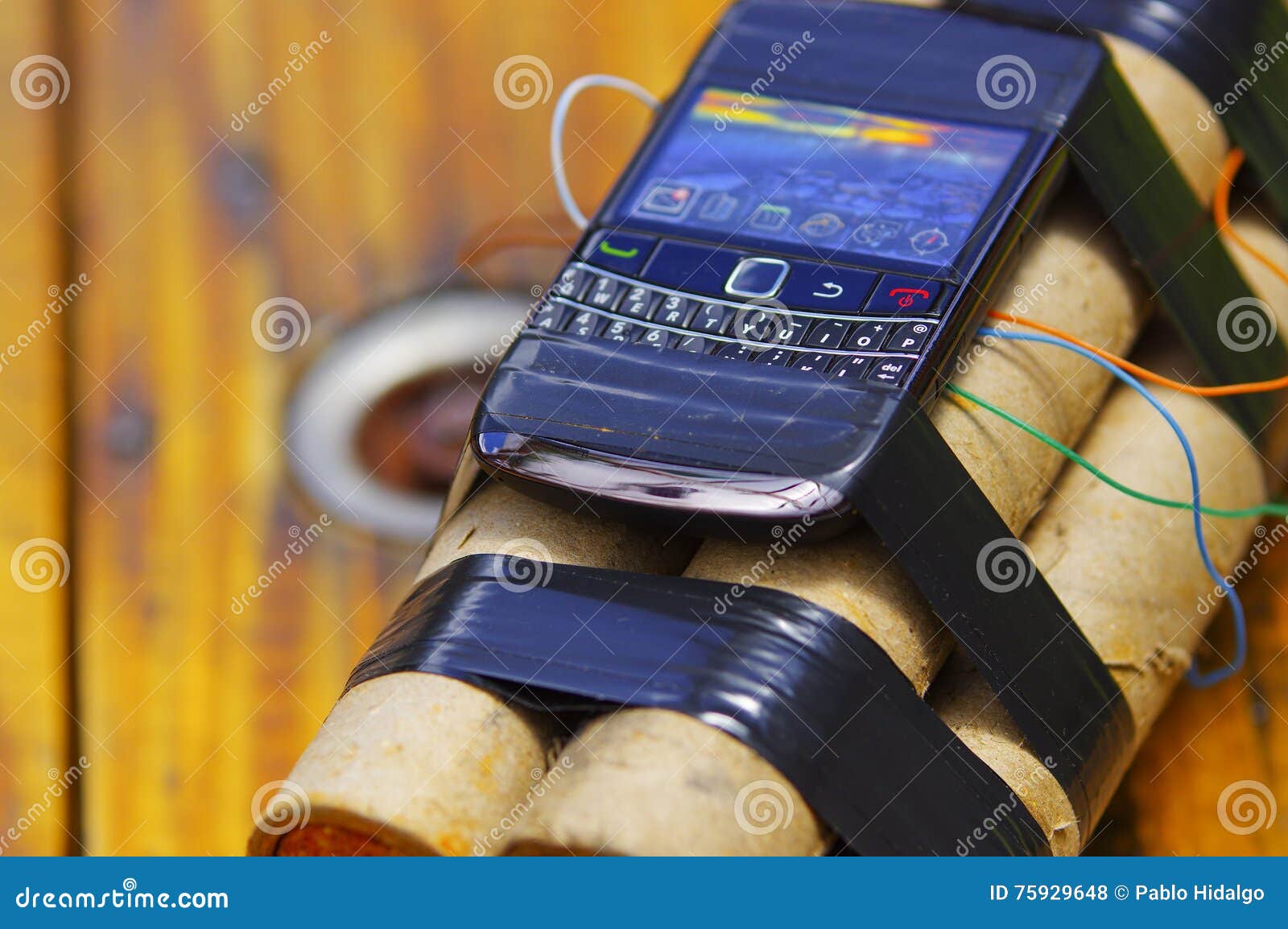 Cellphone Tied To a Set of Explosives Laying on the Ground Stock Photo ...