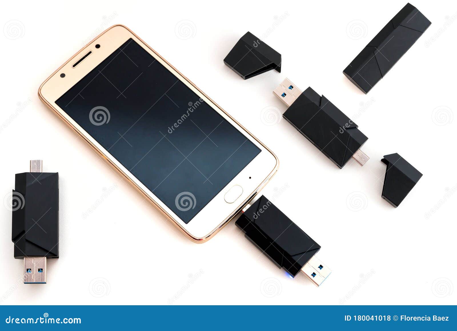 Cellphone and a USB on-the-Go Stock Photo - Image of black, white ...