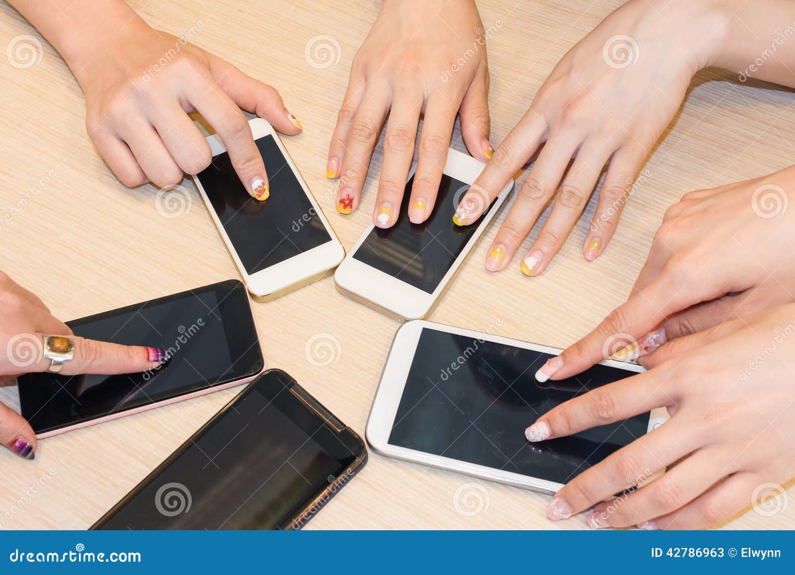Cellphones on desk stock image. Image of screen, finger - 42786963