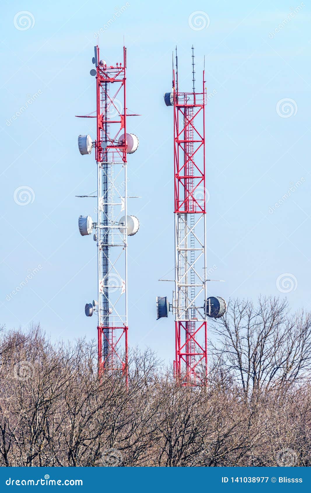 Cellular Mobile Communication Towers in Spring Forest on Blue Sky ...