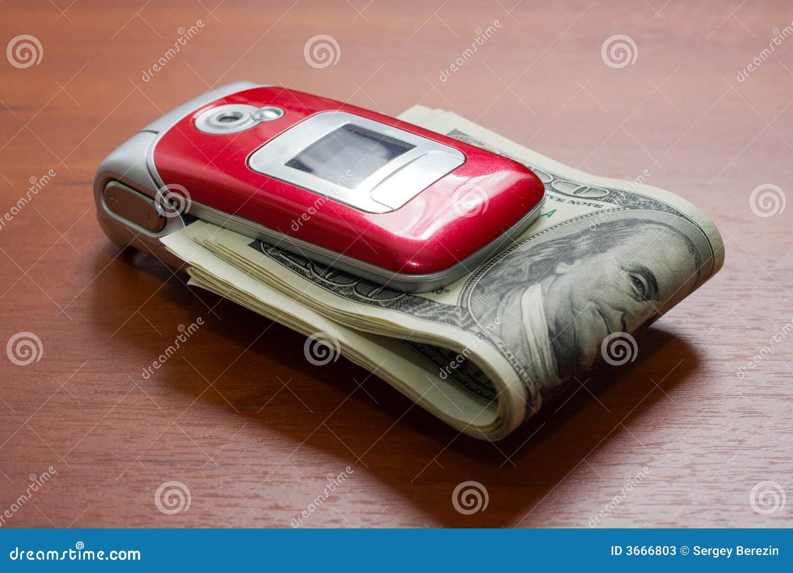 Cellular Telephone with a Pack of Dollars Stock Image - Image of close ...