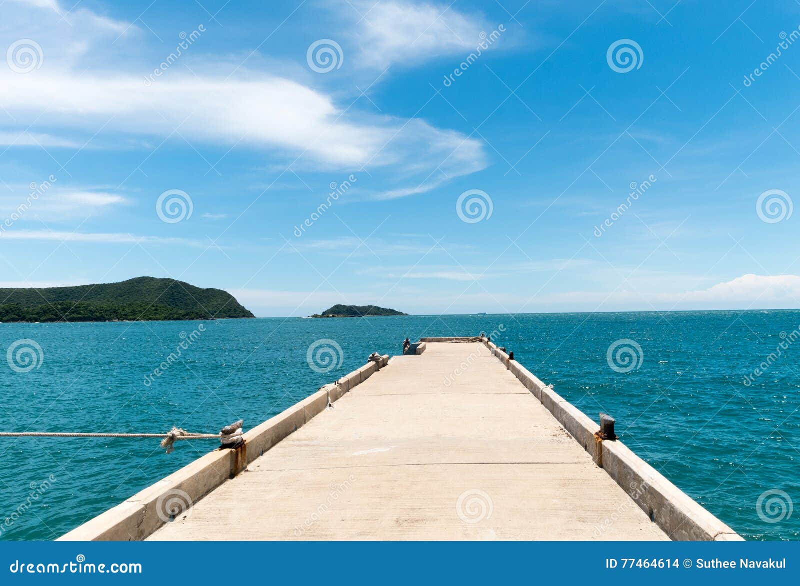 Cement Bridge Extends into the Sea at Ebb Tide Time with Cloudy Sky ...